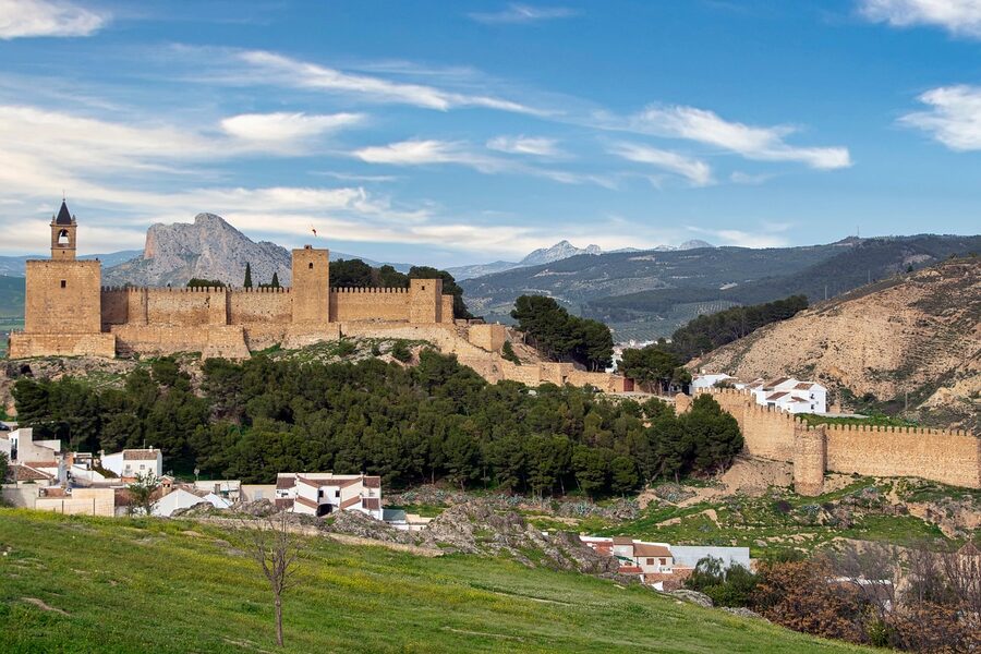 Lush gardens within the Alcazaba fortress walls showing Moorish architectural details