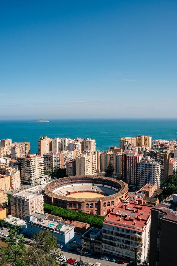 Aerial view of M&aacute;laga bullring and Mediterranean coastline