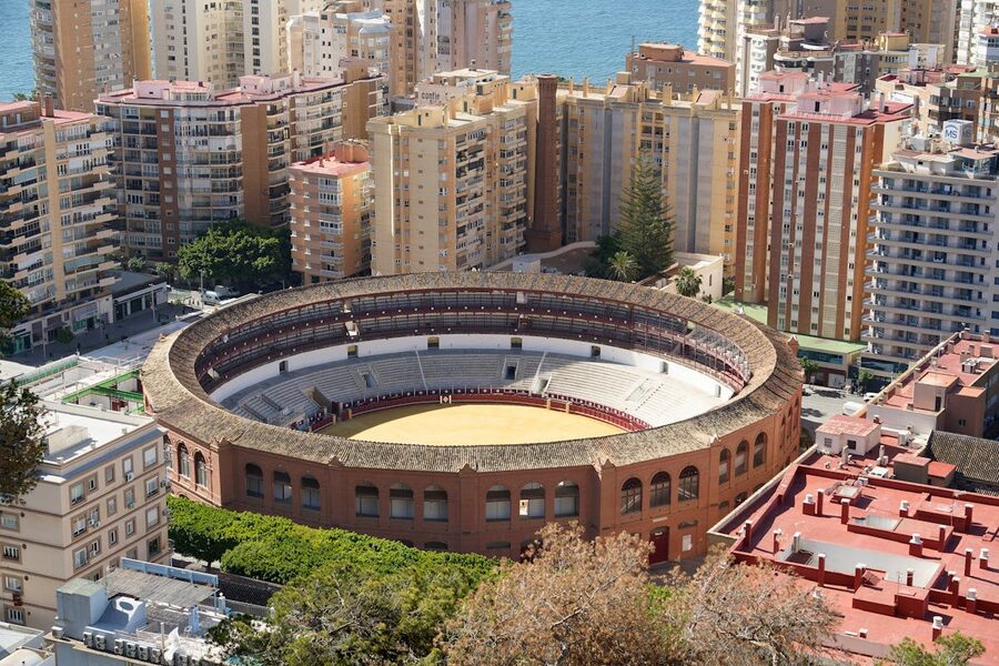 Aerial shot of the iconic La Malagueta bullring in Malaga surrounded by urban architecture