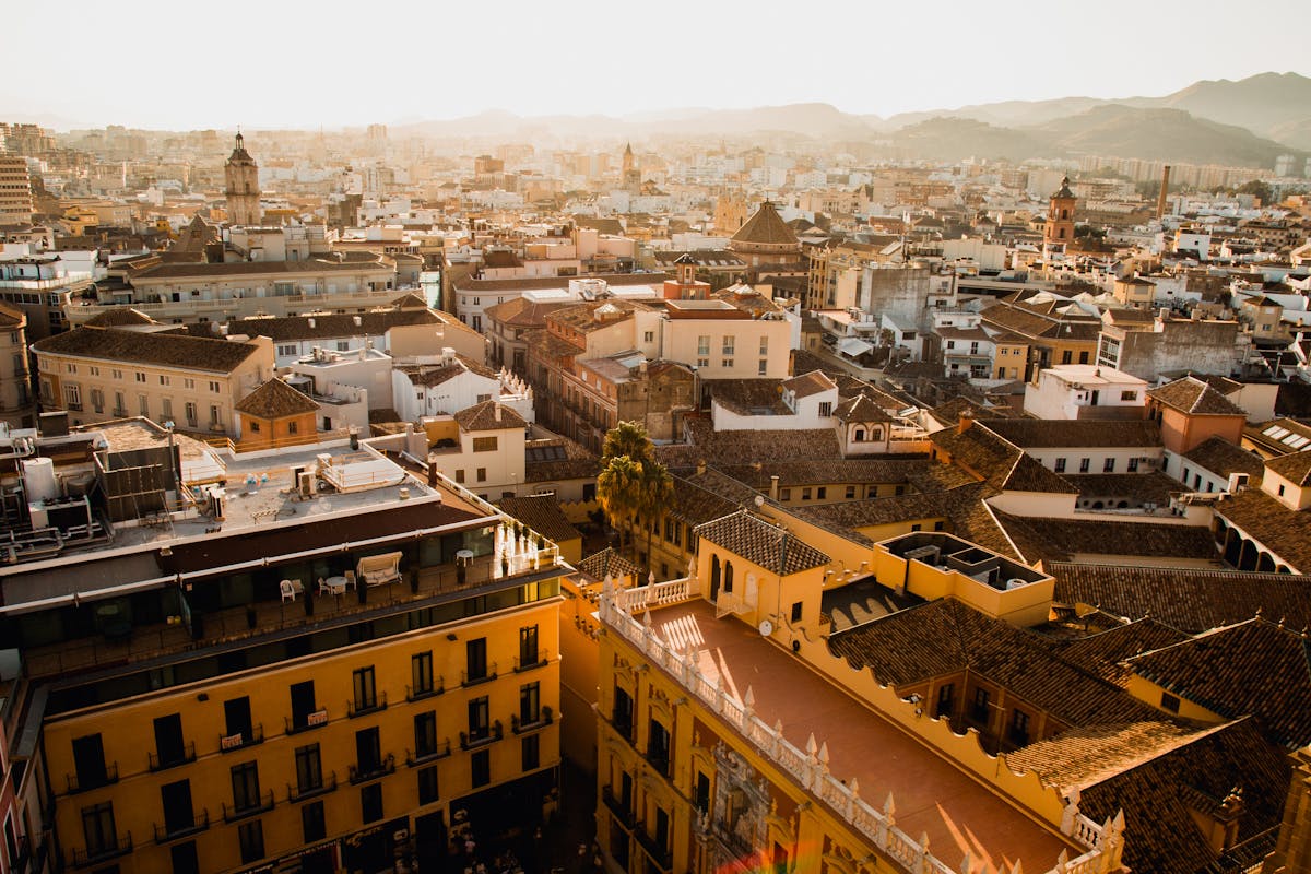 Malaga historic cityscape at sunset from above showcasing iconic landmarks
