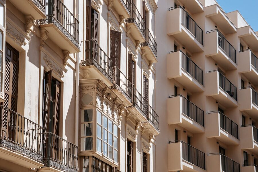 Classic and modern architecture side by side in sunny Malaga Spain