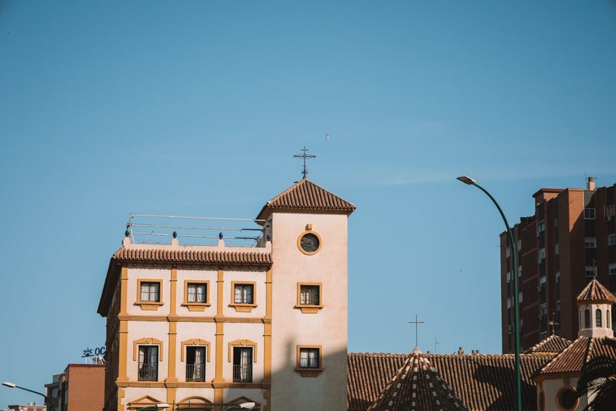 Historic building with period architecture against clear blue sky in Malaga Spain