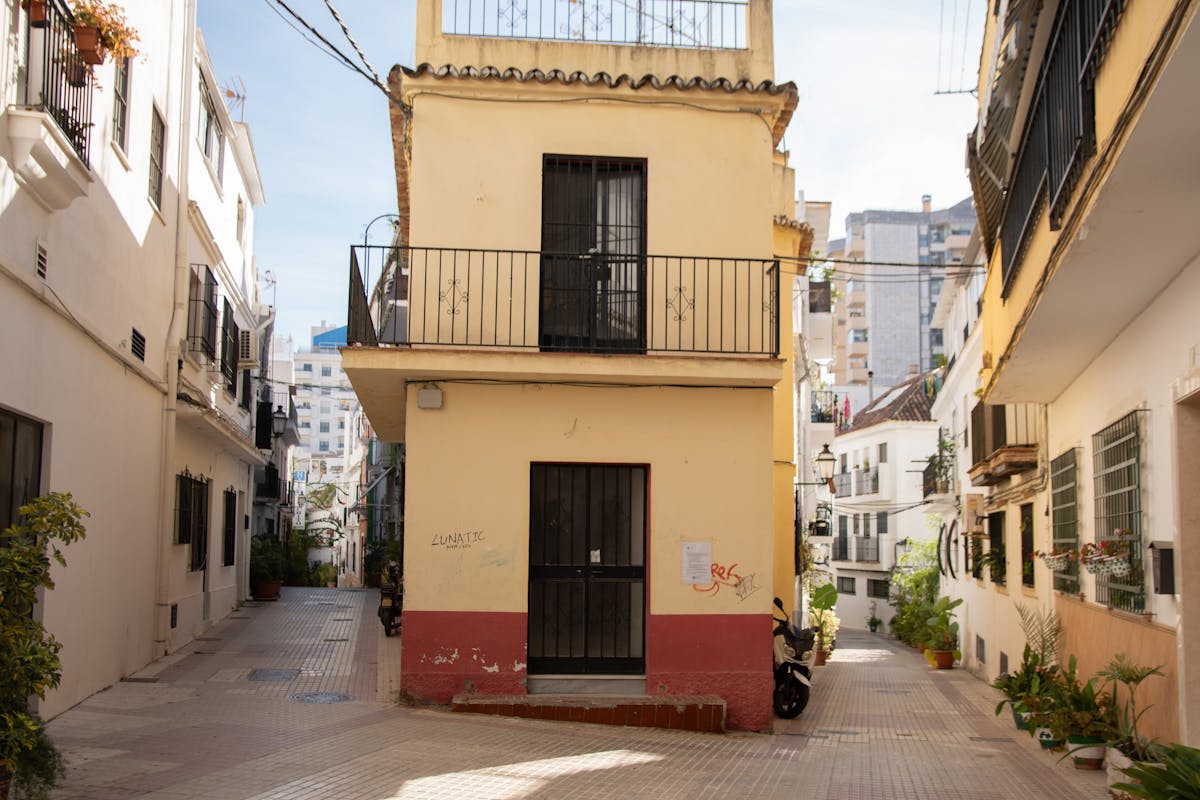 Narrow alleyway with Mediterranean architecture in Malaga old town