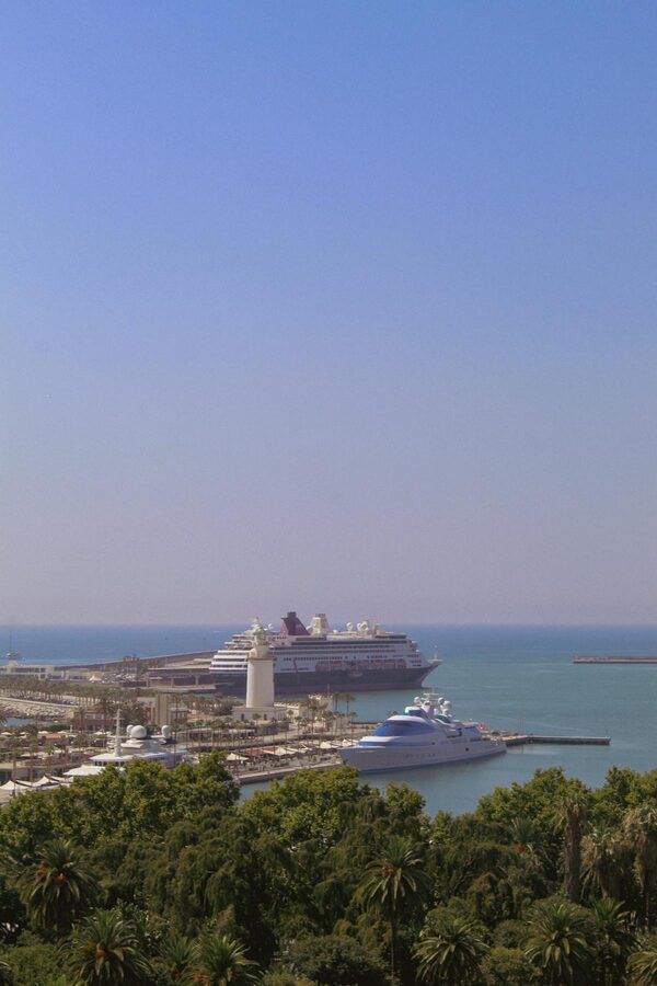 M&aacute;laga port with cruise ships docked under clear blue skies