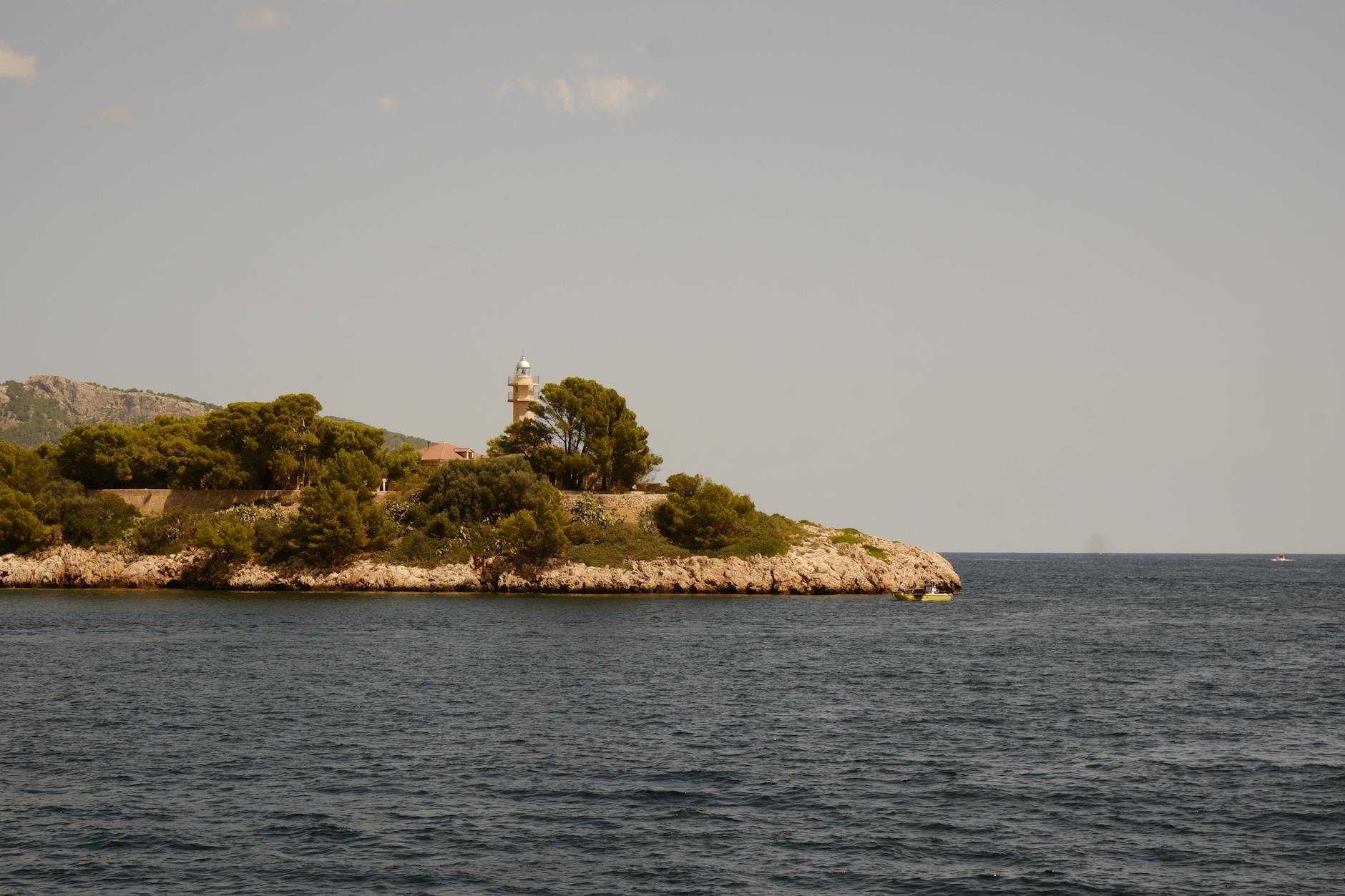 Drone shot of the Mallorca coastline showing turquoise waters and green hillsides