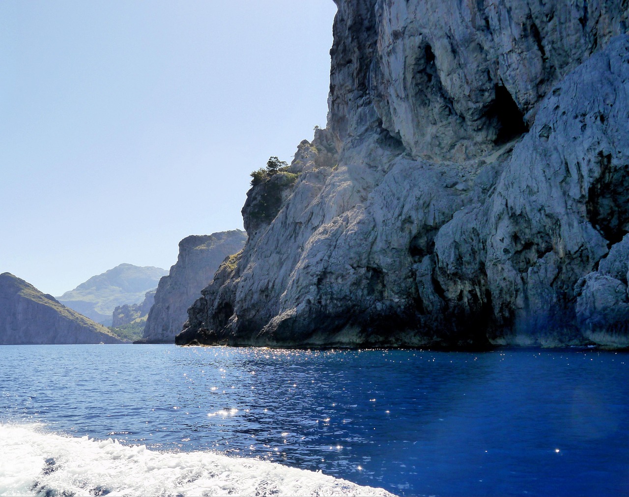 Rocky cliffs and cave formations along Mallorca's east coast