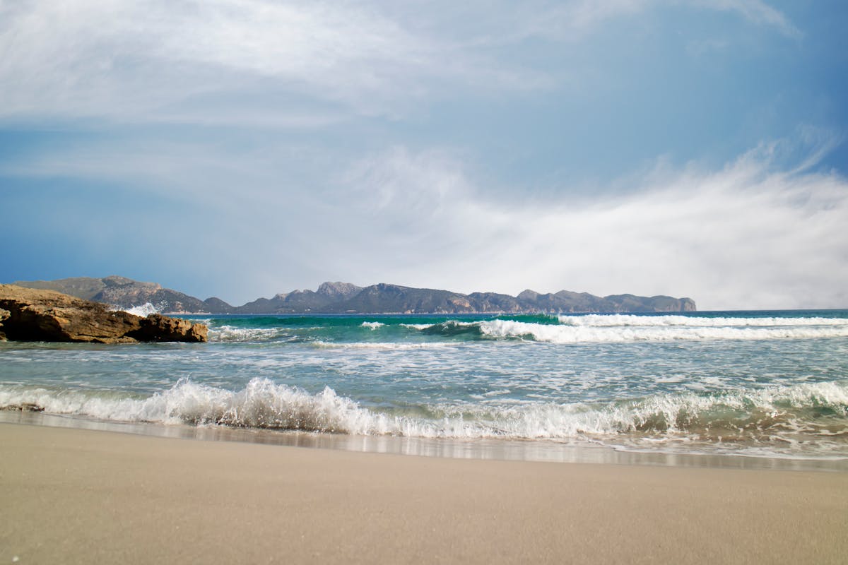 Serene beach with gentle waves in the Balearic Islands Spain