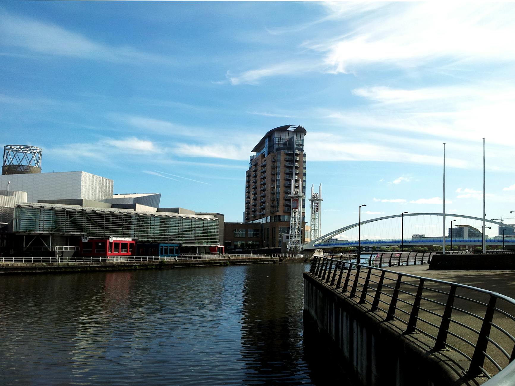 Contemporary apartment blocks and office buildings along the Manchester Ship Canal waterfront