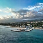 Aerial view of Marbella coastline with mountains and Mediterranean Sea