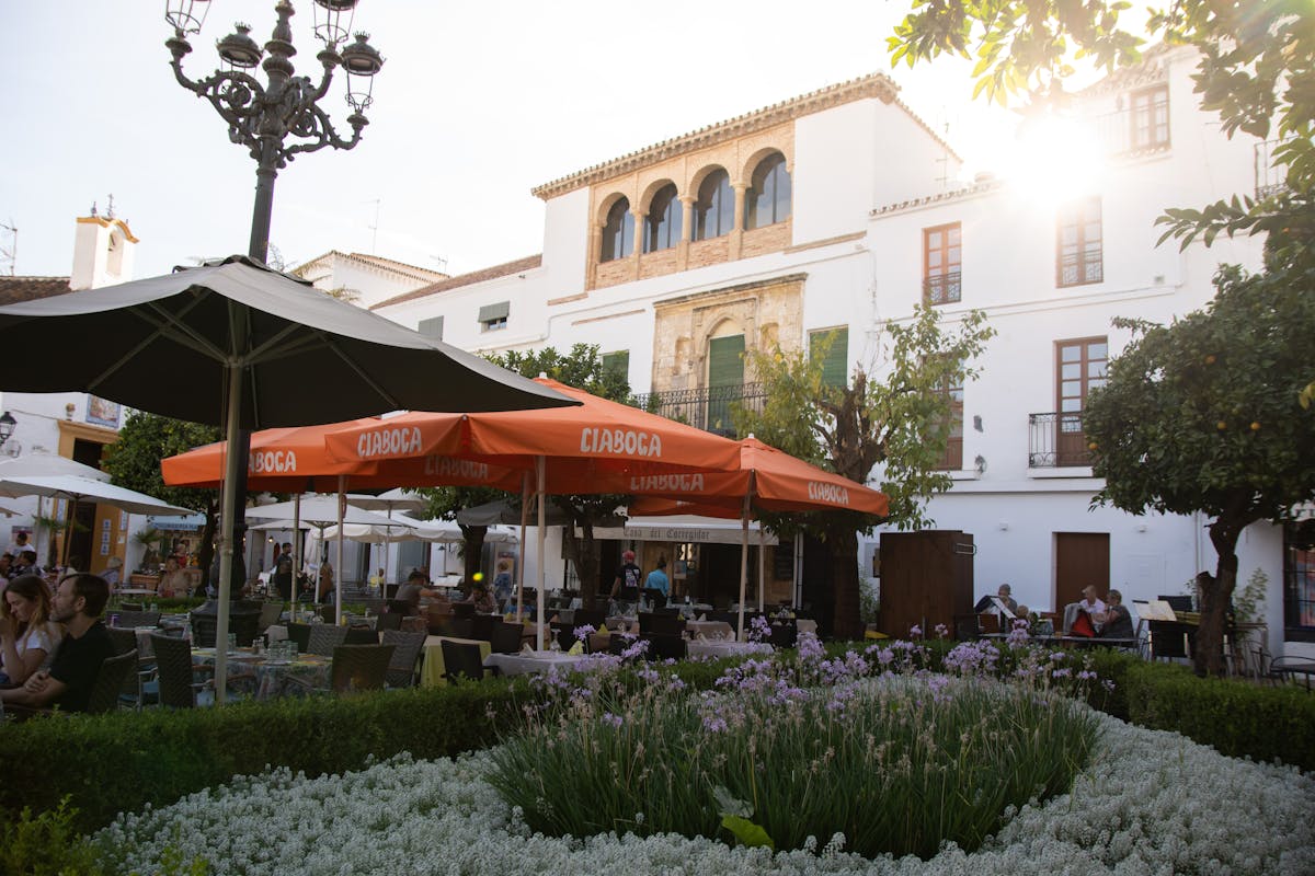 Cafe dining in historic Plaza de los Naranjos square in Marbella