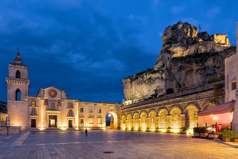 Piazza San Pietro Caveoso in Matera photographed at blue hour with the church and cave dwellings