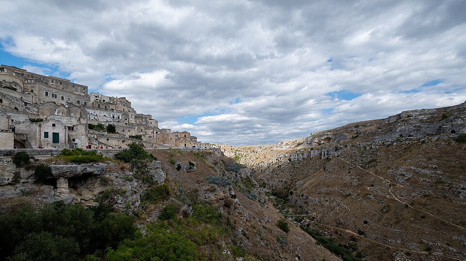 Panoramic view of the ancient Sassi di Matera cave dwellings carved into the hillside in southern Italy