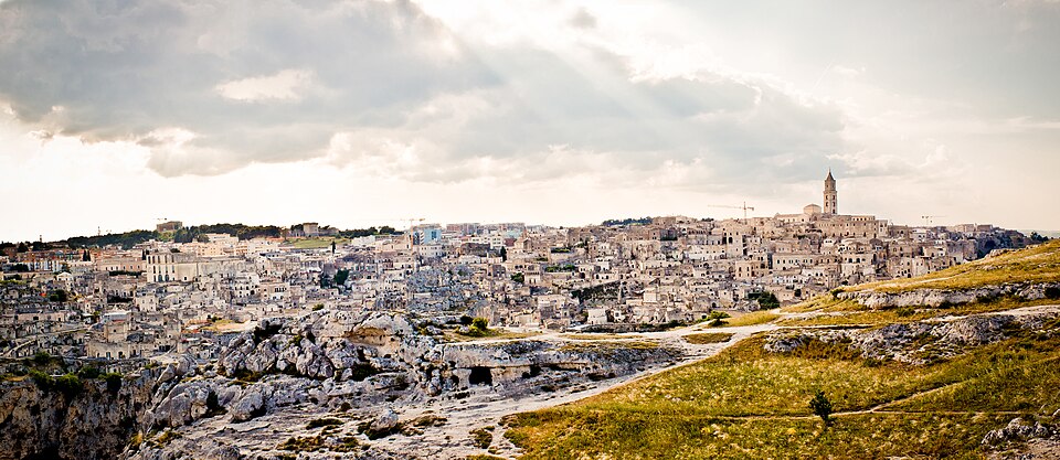 Wide panoramic view of Matera showing the Sassi cave districts spread across the canyon