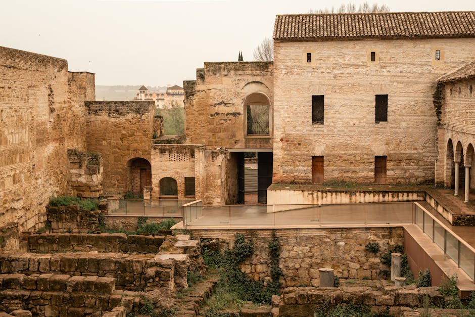 Stone arches and architectural remains at Medina Azahara ruins in Cordoba
