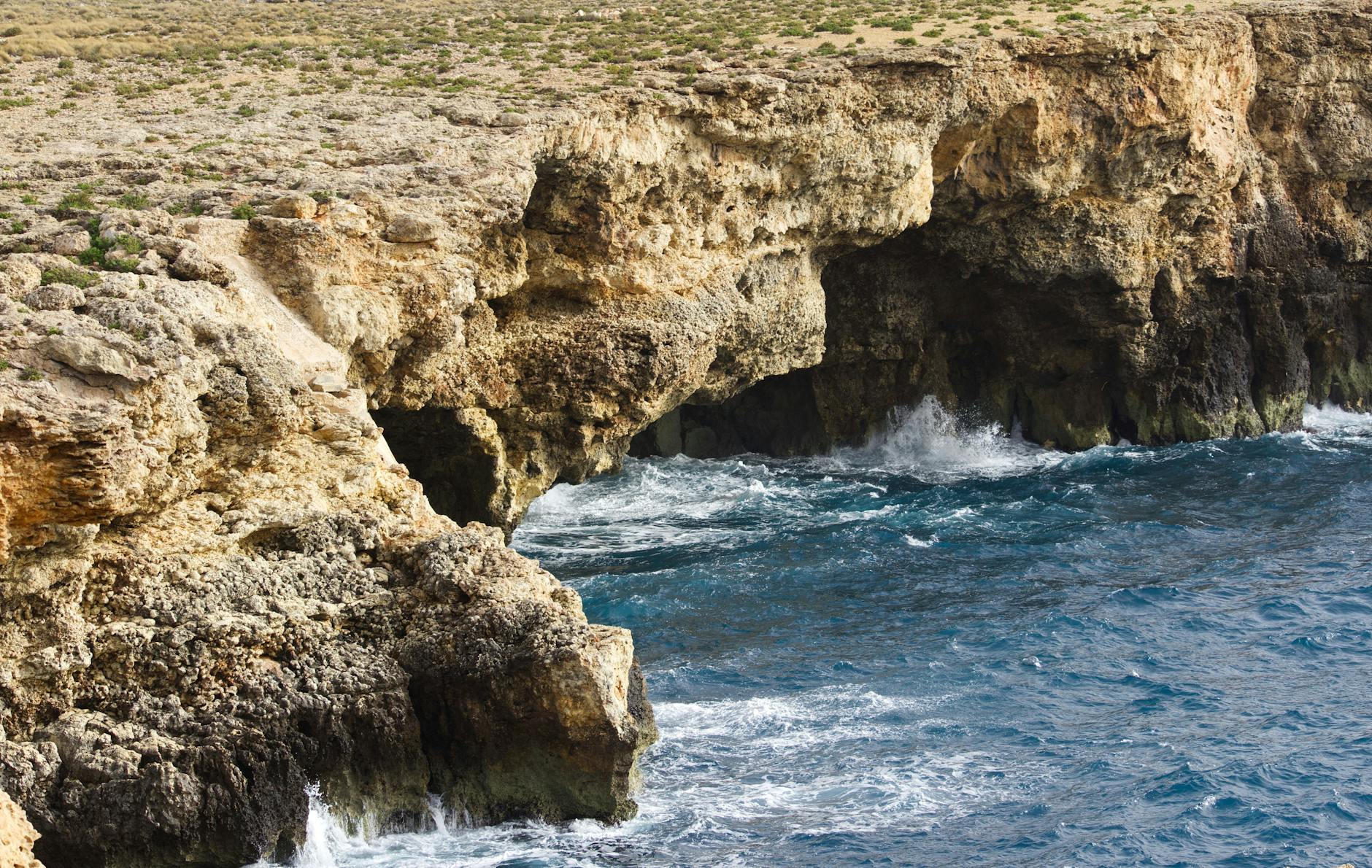 Dramatic sea cliffs meeting deep blue Mediterranean water