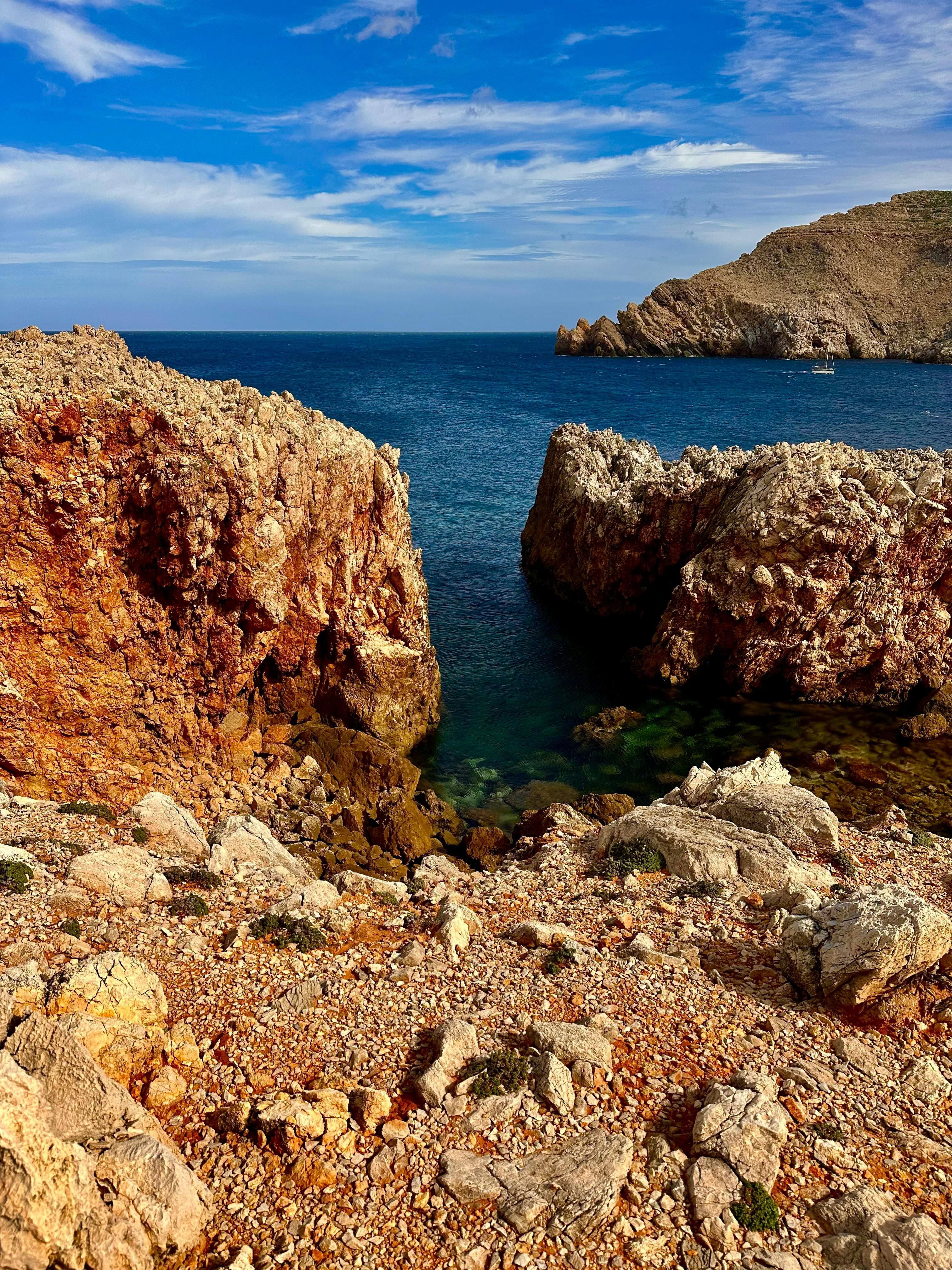 Rocky coastline with blue sea waters along the Menorca coast