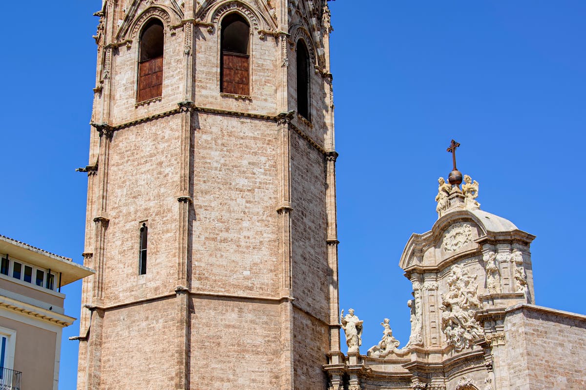 The Miguelete bell tower of Valencia Cathedral under a clear blue sky
