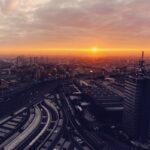 Aerial view of Milan Italy at sunset showing the city skyline