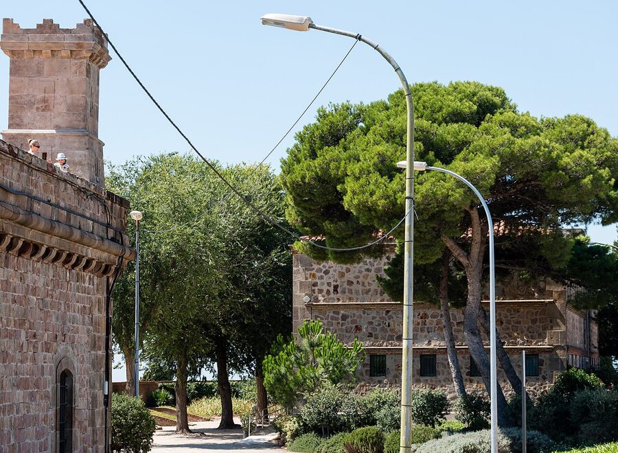Interior courtyard of Montjuic Castle with stone walls and sky
