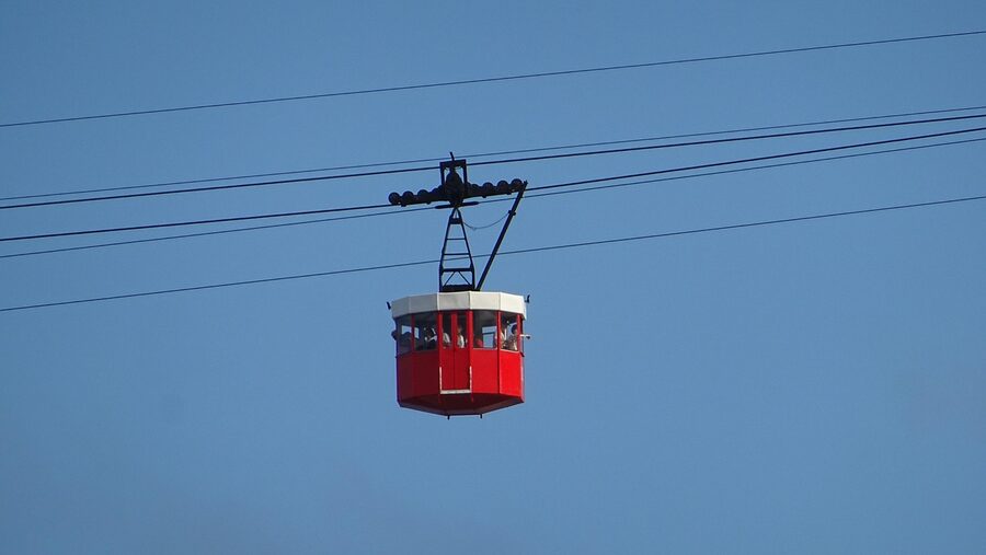 Cable car over Barcelona port with Montjuic visible in background