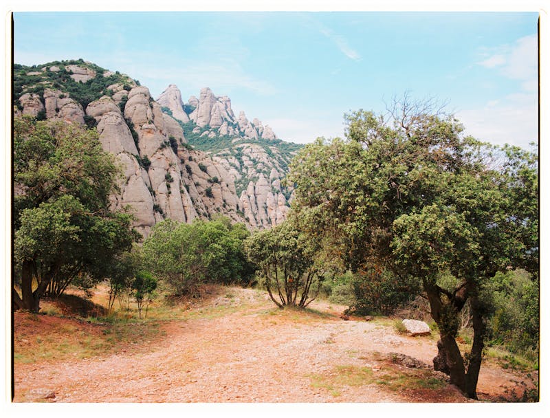 Lush green mountainside with distinctive rock formations at Montserrat