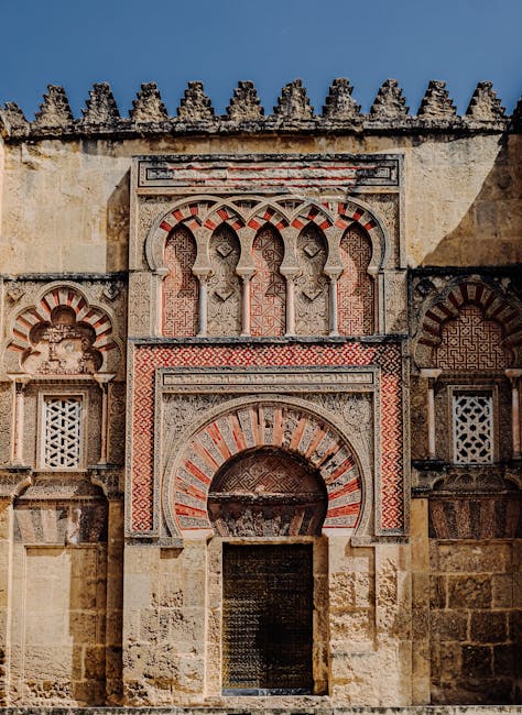 Detailed Moorish architectural facade in Cordoba showing carved stonework