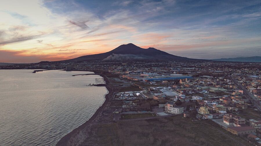 Aerial view of Mount Vesuvius overlooking bay area near Naples at sunset