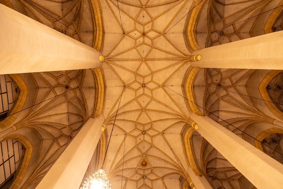 Intricate Gothic cathedral ceiling with vaulted arches and pillars in Munich