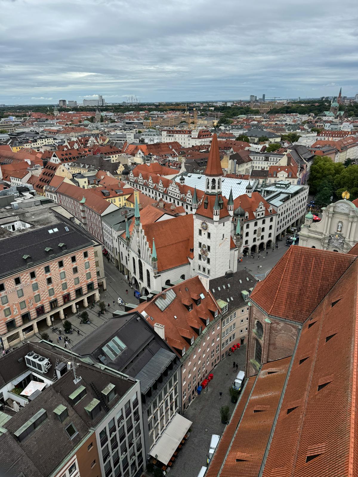 Aerial view of Munich showing historic red rooftops and architecture