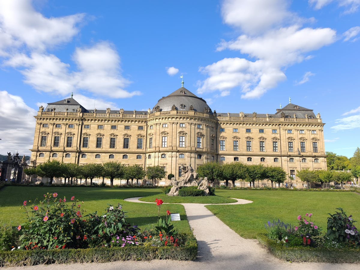 Residenz Palace in Munich with its formal gardens under a clear sky