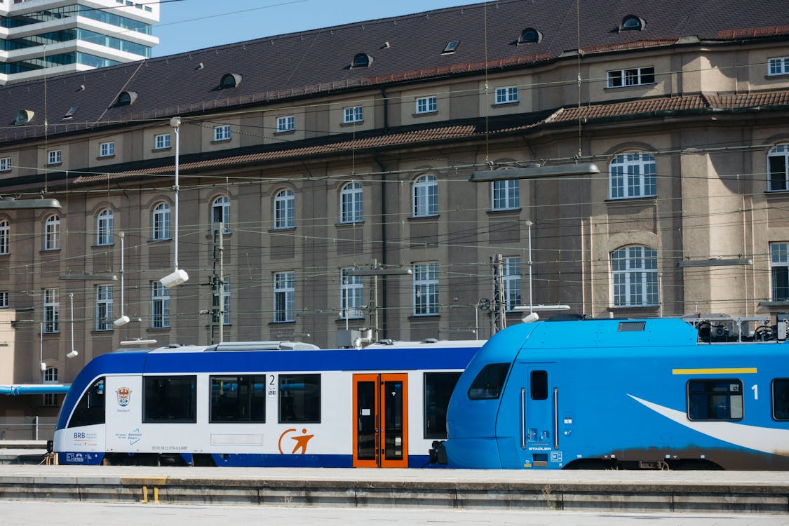 Blue and white regional train at a German station platform