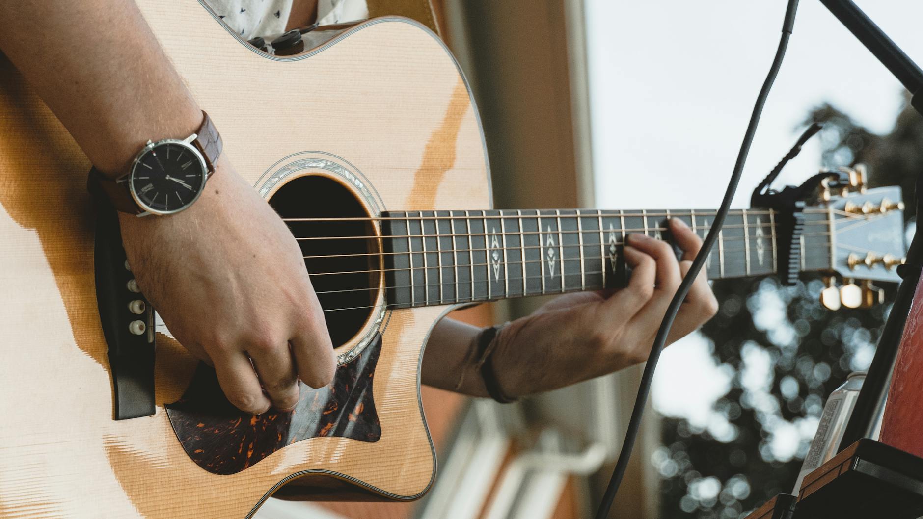 Musician performing at an evening outdoor event