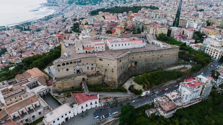 Aerial view of Castel Sant Elmo surrounded by the dense Naples cityscape