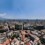 Aerial panoramic view of Naples city with Mount Vesuvius volcano in the background