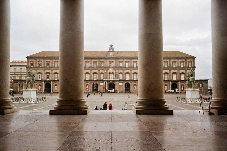 View of Royal Palace in Naples framed by historic columns