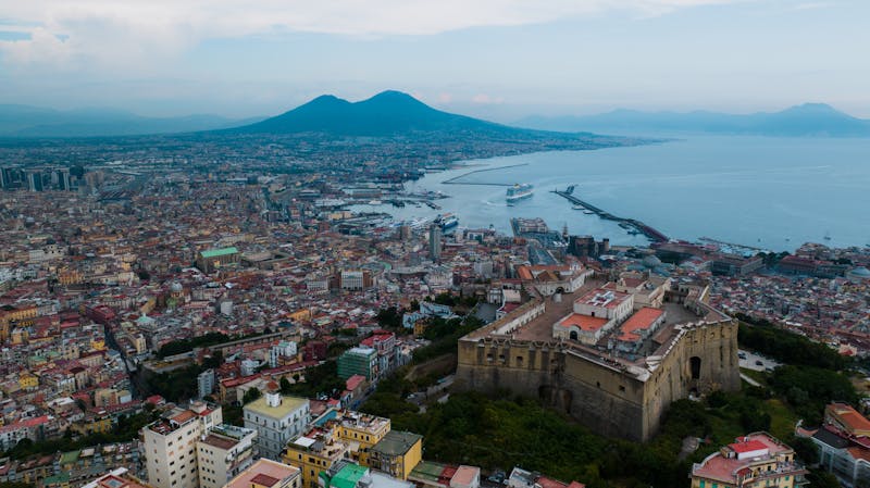 Aerial view of Naples featuring Castel Sant Elmo and Mount Vesuvius