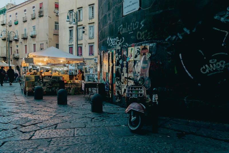 Bustling evening street market in historic Naples Italy