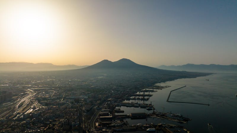Scenic view of Mount Vesuvius at sunrise with Naples below