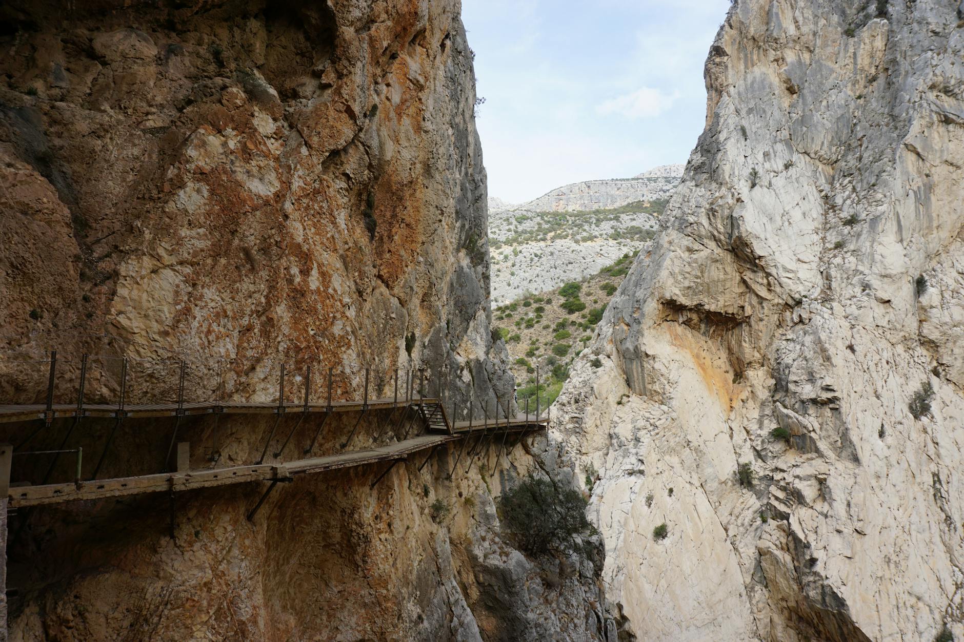 Narrow pathway through rugged rock formations in canyon