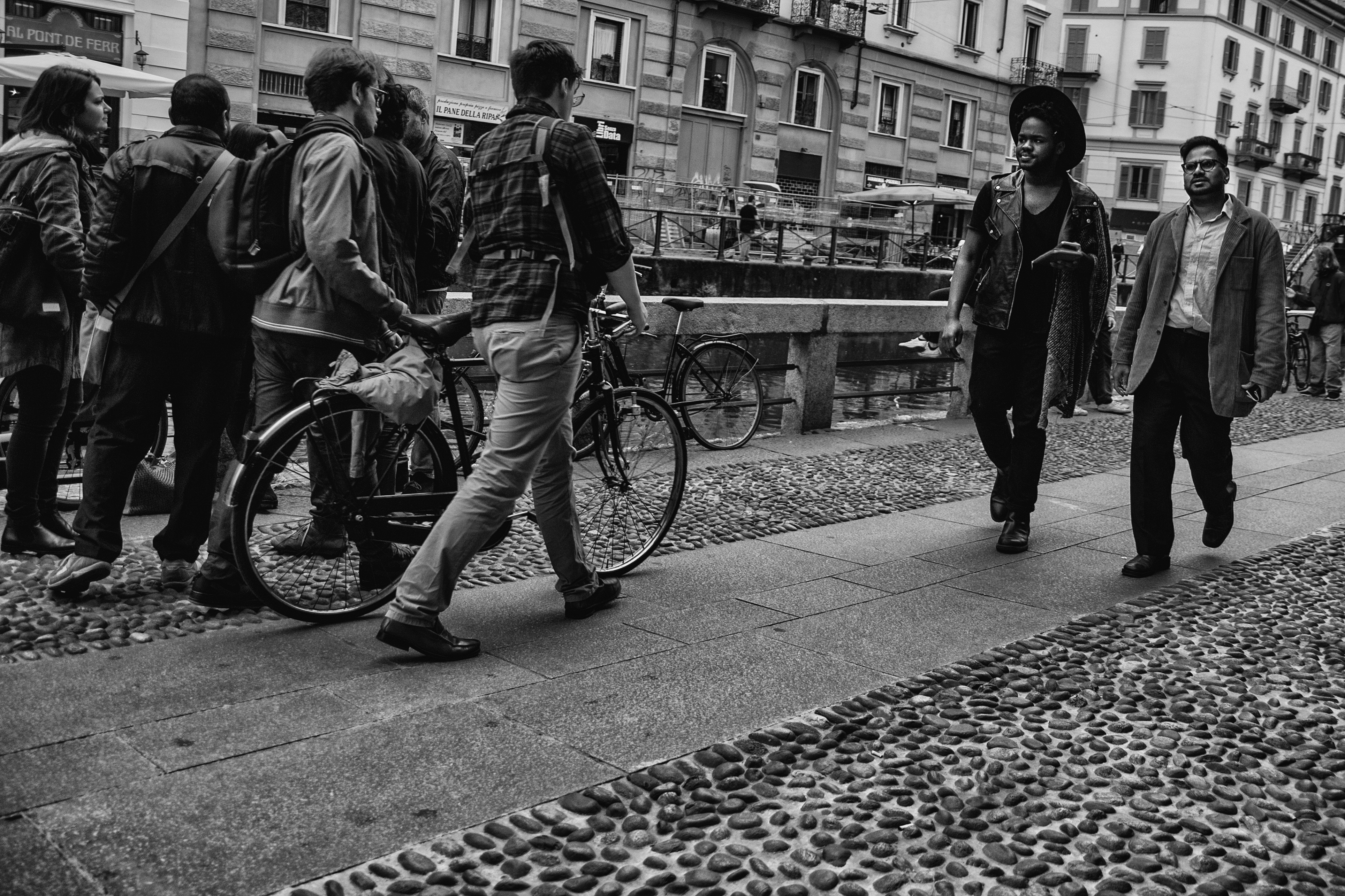 The Navigli canal district in Milan with restaurants and reflections