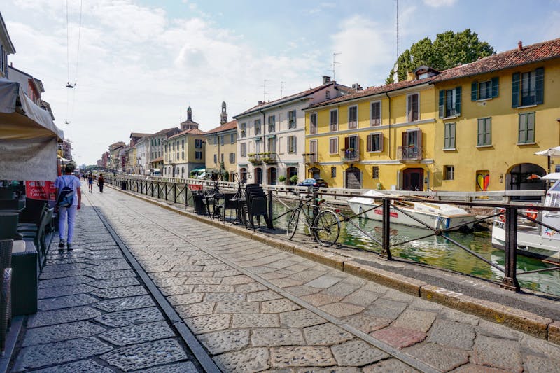 Row of colorful buildings along a canal in Milan Navigli district