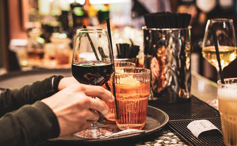 Spritz and wine glasses at a Milan bar during aperitivo hour