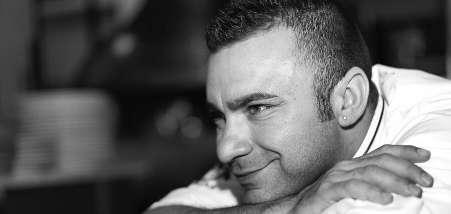 Neapolitan pizzaiolo Davide Civitiello preparing pizza