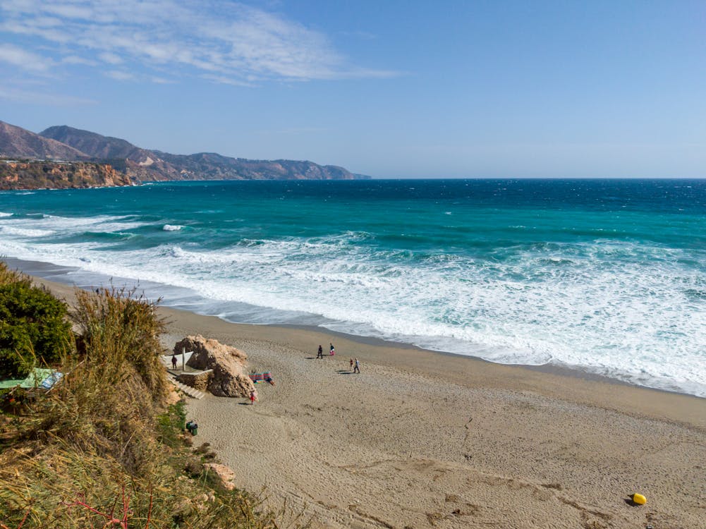 Aerial view of Nerja Beach with turquoise waters and coastline