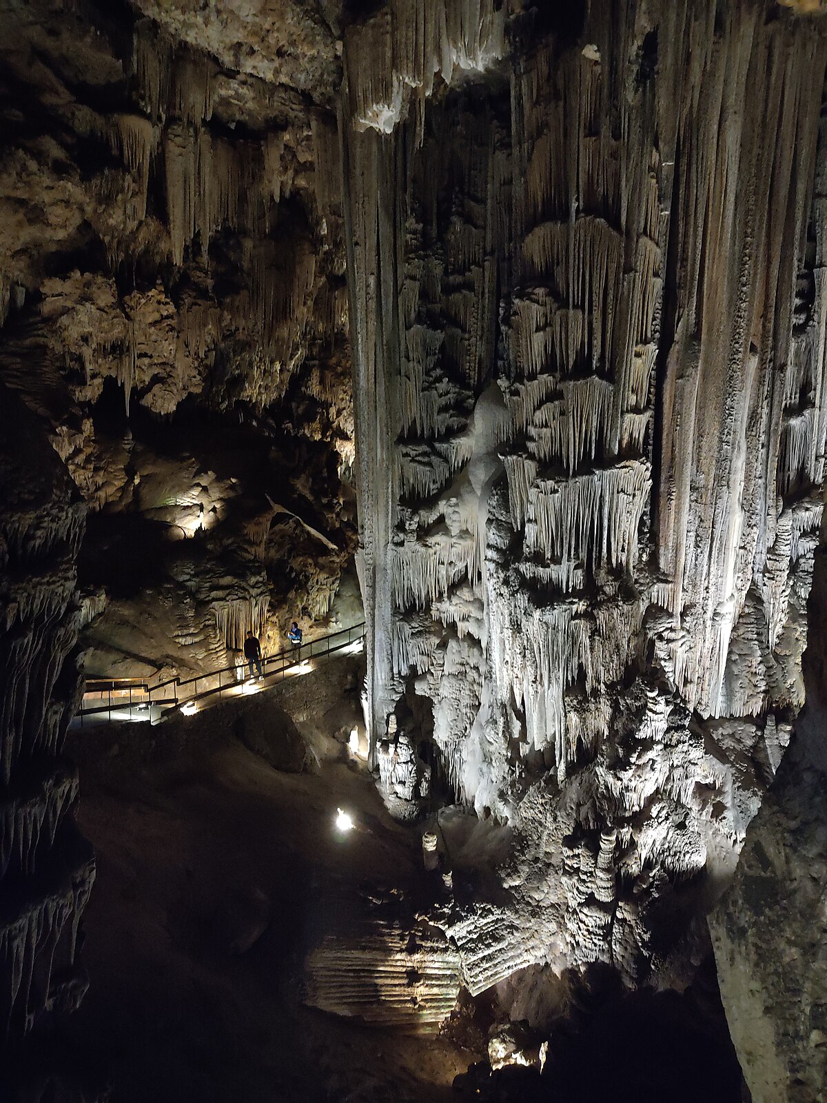 Tall stalactite column formation inside the Caves of Nerja