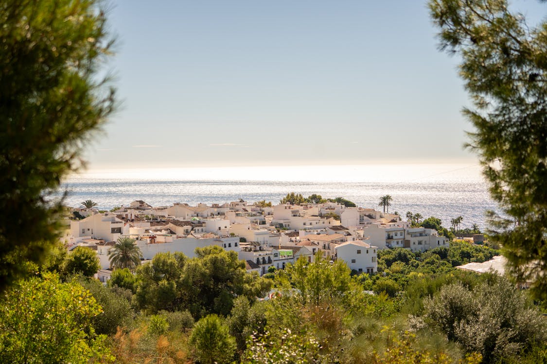 Coastal view of Nerja with Mediterranean Sea and whitewashed buildings