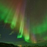 Northern lights aurora borealis over Iceland landscape