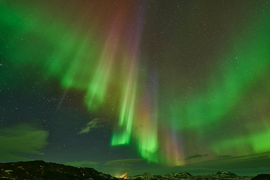 Northern lights aurora borealis over Iceland landscape