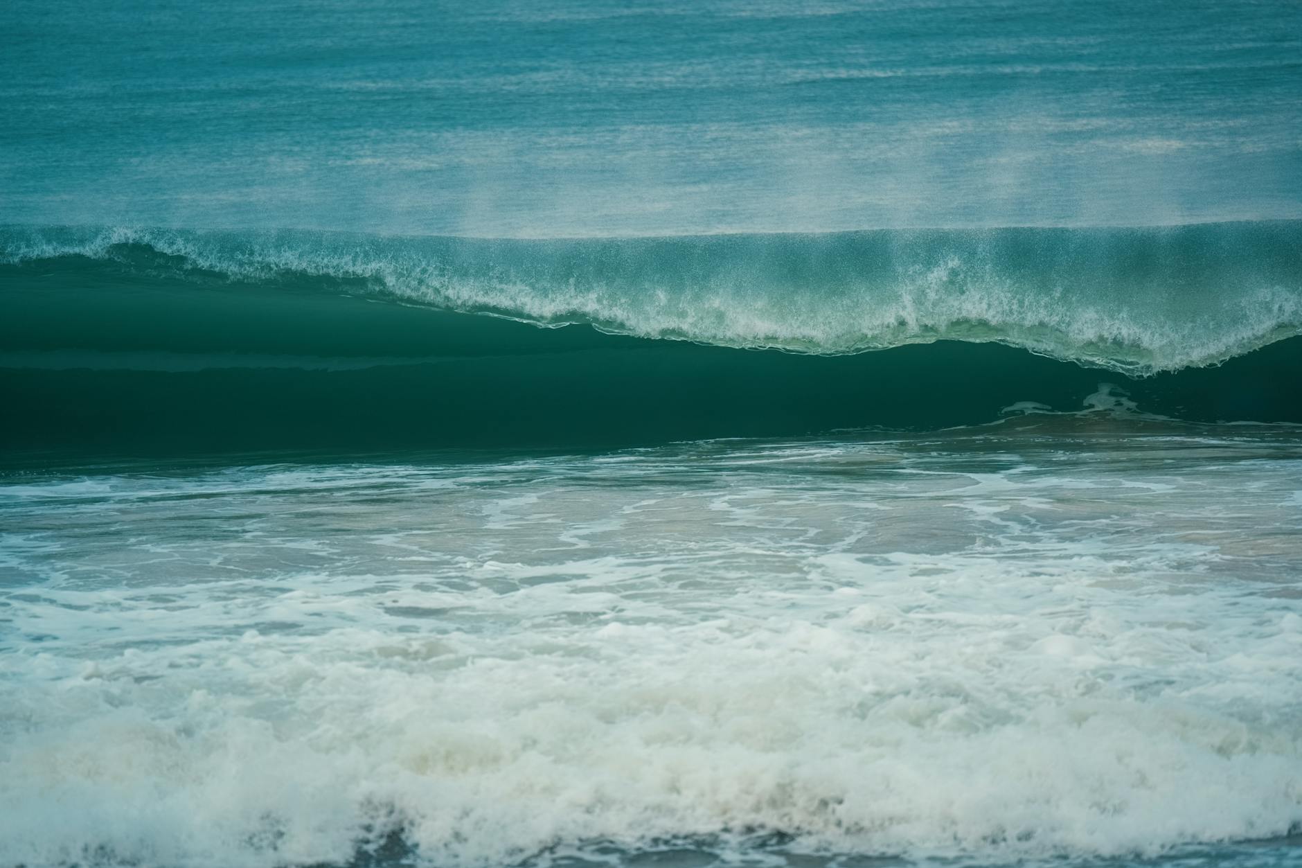 Tranquil ocean wave rolling gently at the seashore