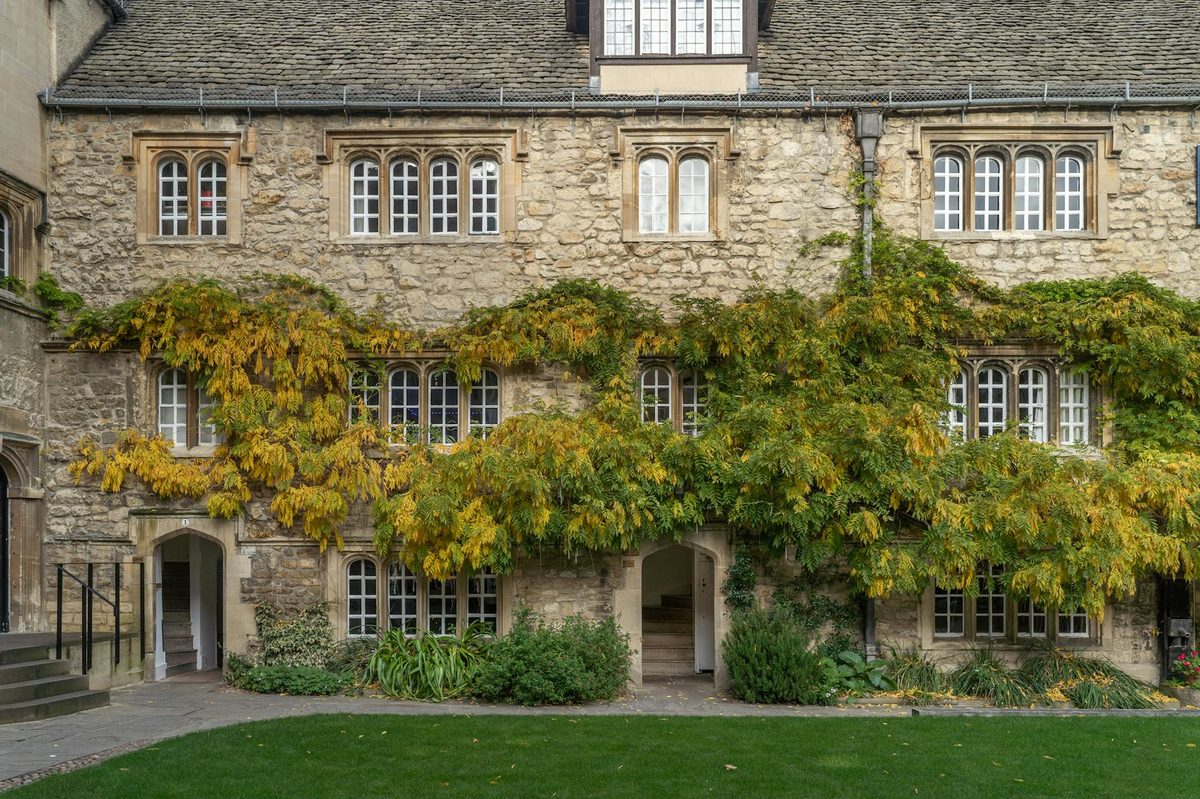 Ivy-covered stone facade of St Edmund Hall Oxford